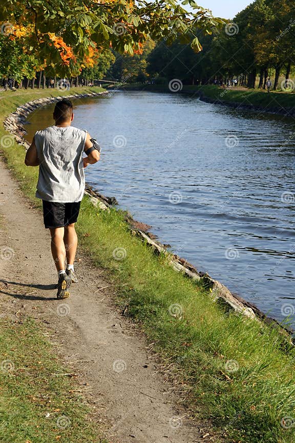 Jogging by the water stock photo. Image of male, lone, running - 260462