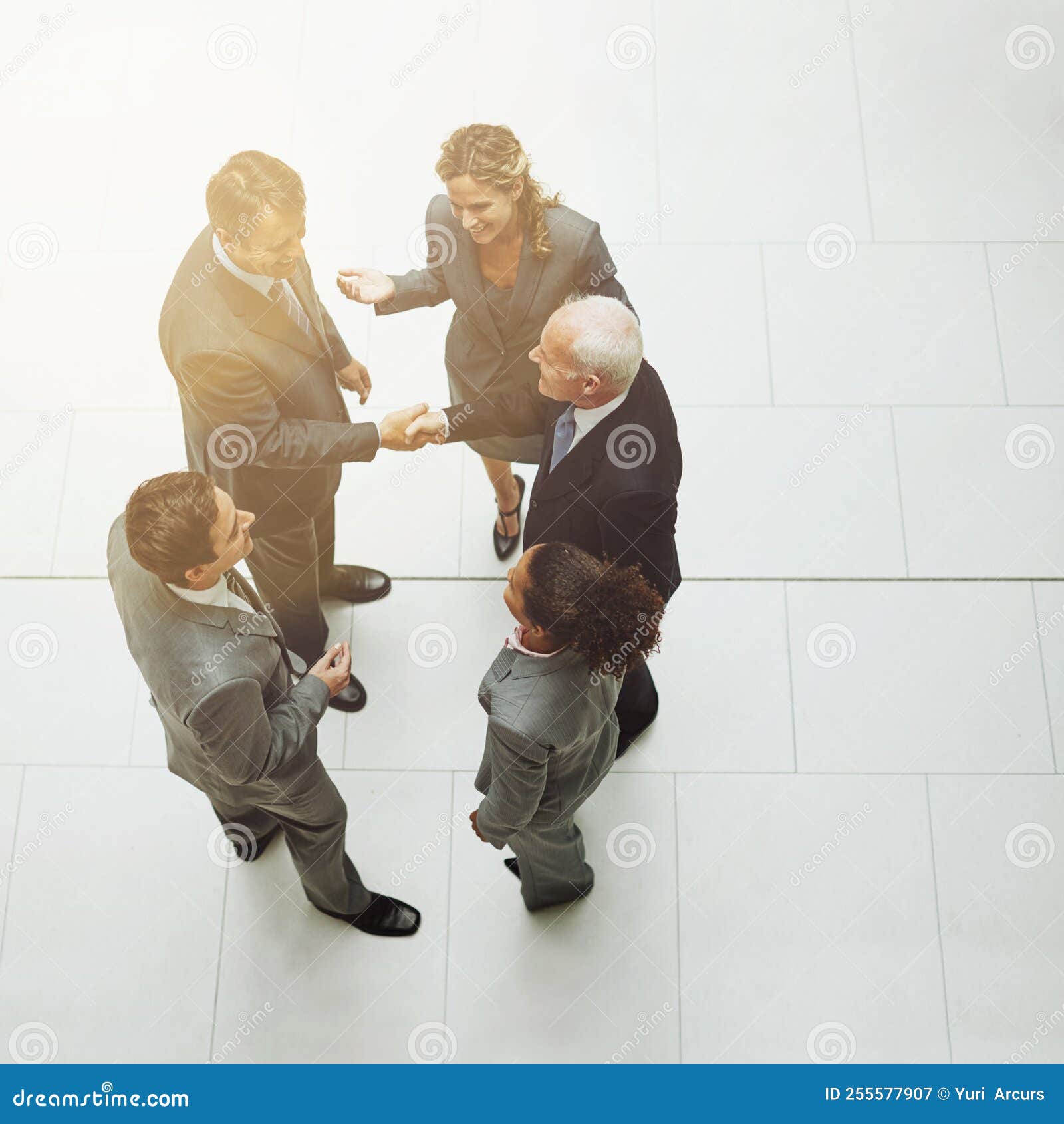 Joining Forces. High Angle Shot of Two Groups of Business Teams Meeting ...
