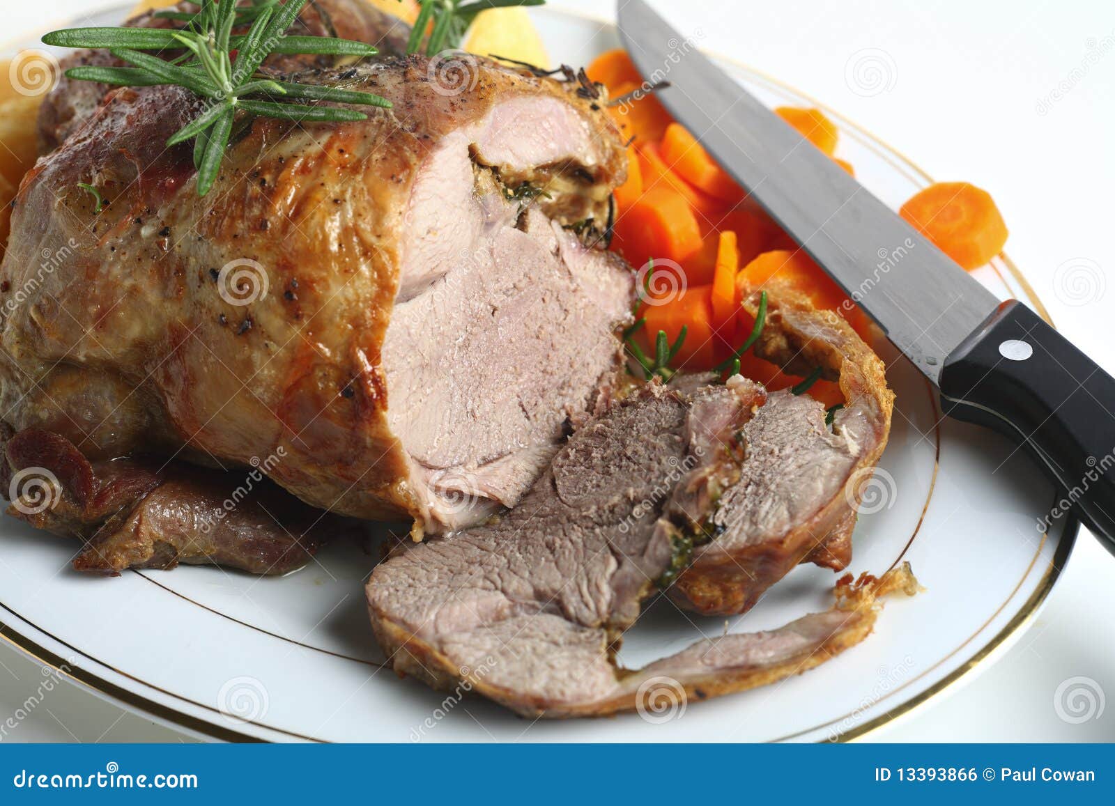 Joint of Lamb with Carving Knife Stock Photo - Image of food, plate ...