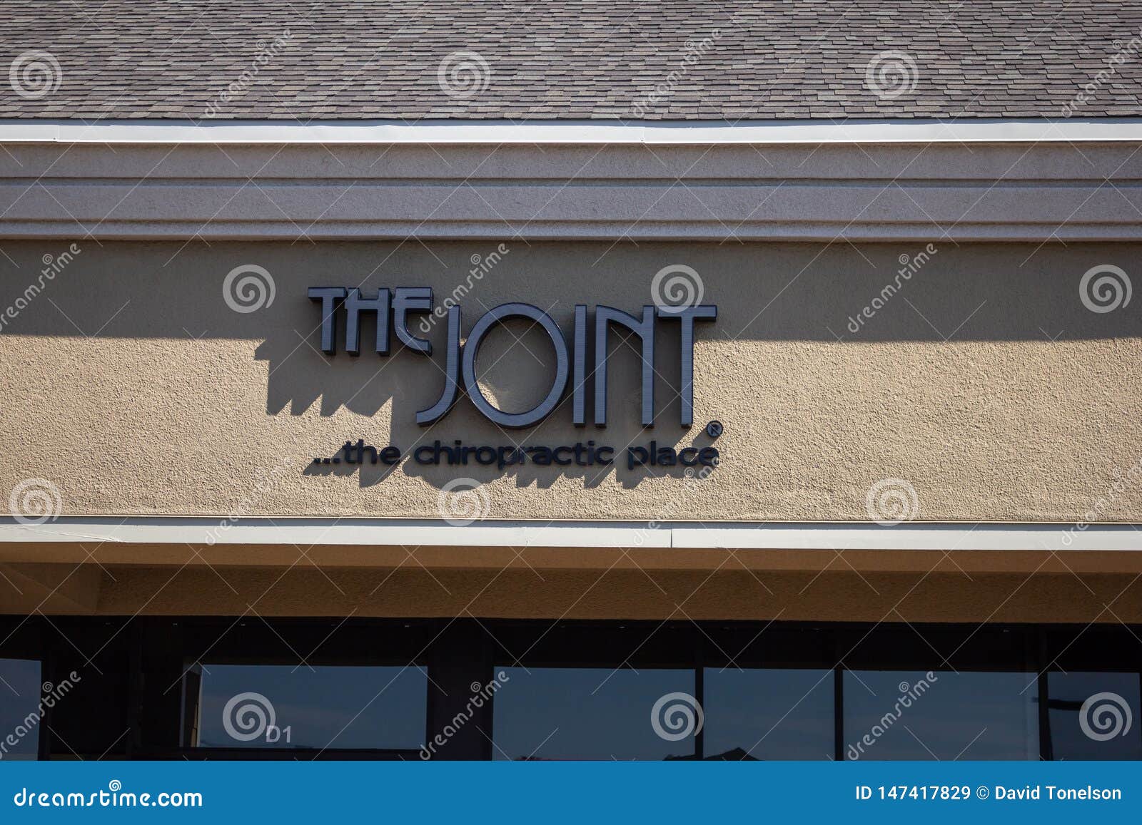 The Joint store sign editorial stock image. Image of professional ...