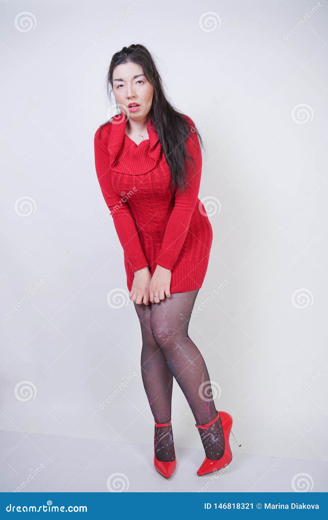 Pretty Asian Chubby Woman Posing In Red Knitted Dress And Black