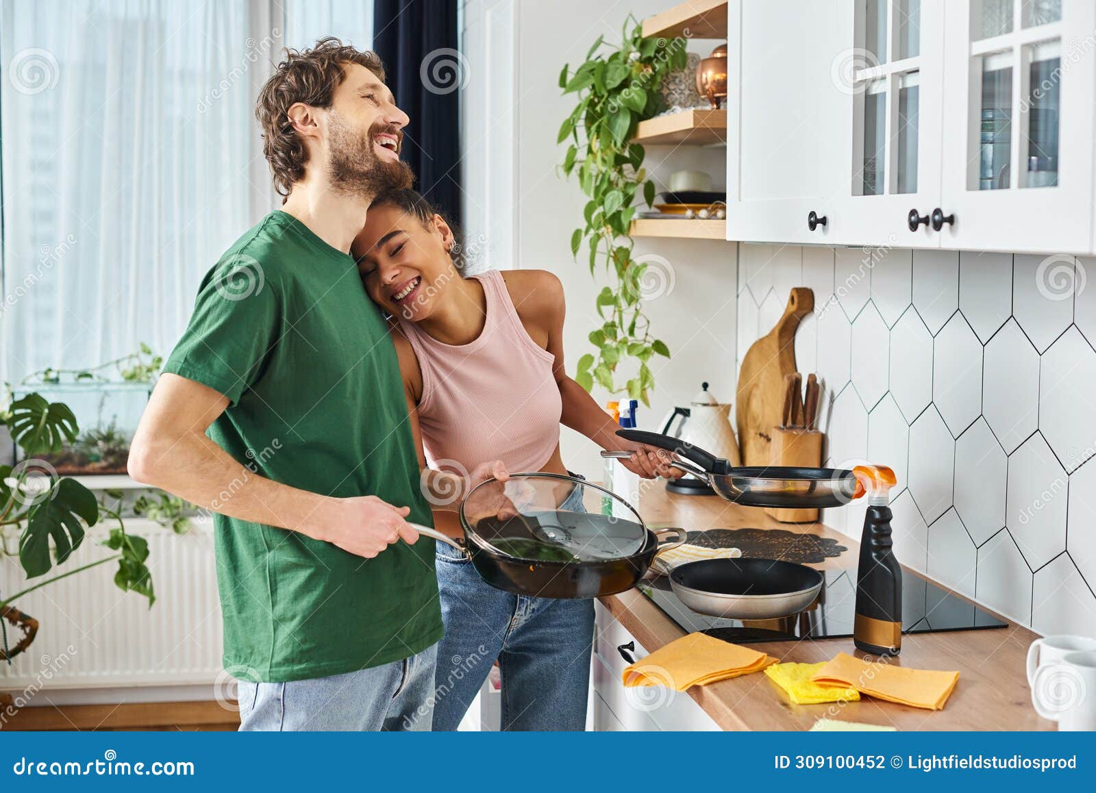 Jolly Attractive Multicultural Couple in Homewear Stock Photo - Image ... Jolly Attractive Multicultural Couple in Homewear Stock Photo - Image ...