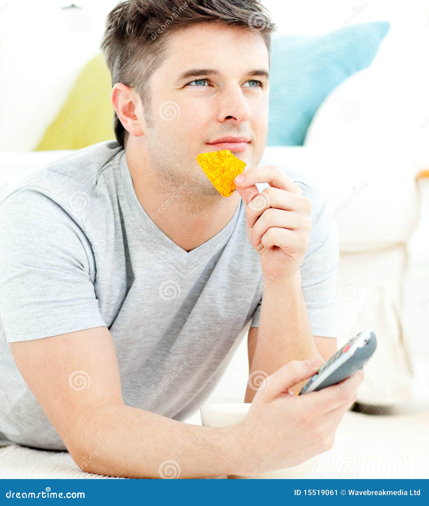 Jolly Man with Remote Eating Crisps on the Floor Stock Image - Image of ...