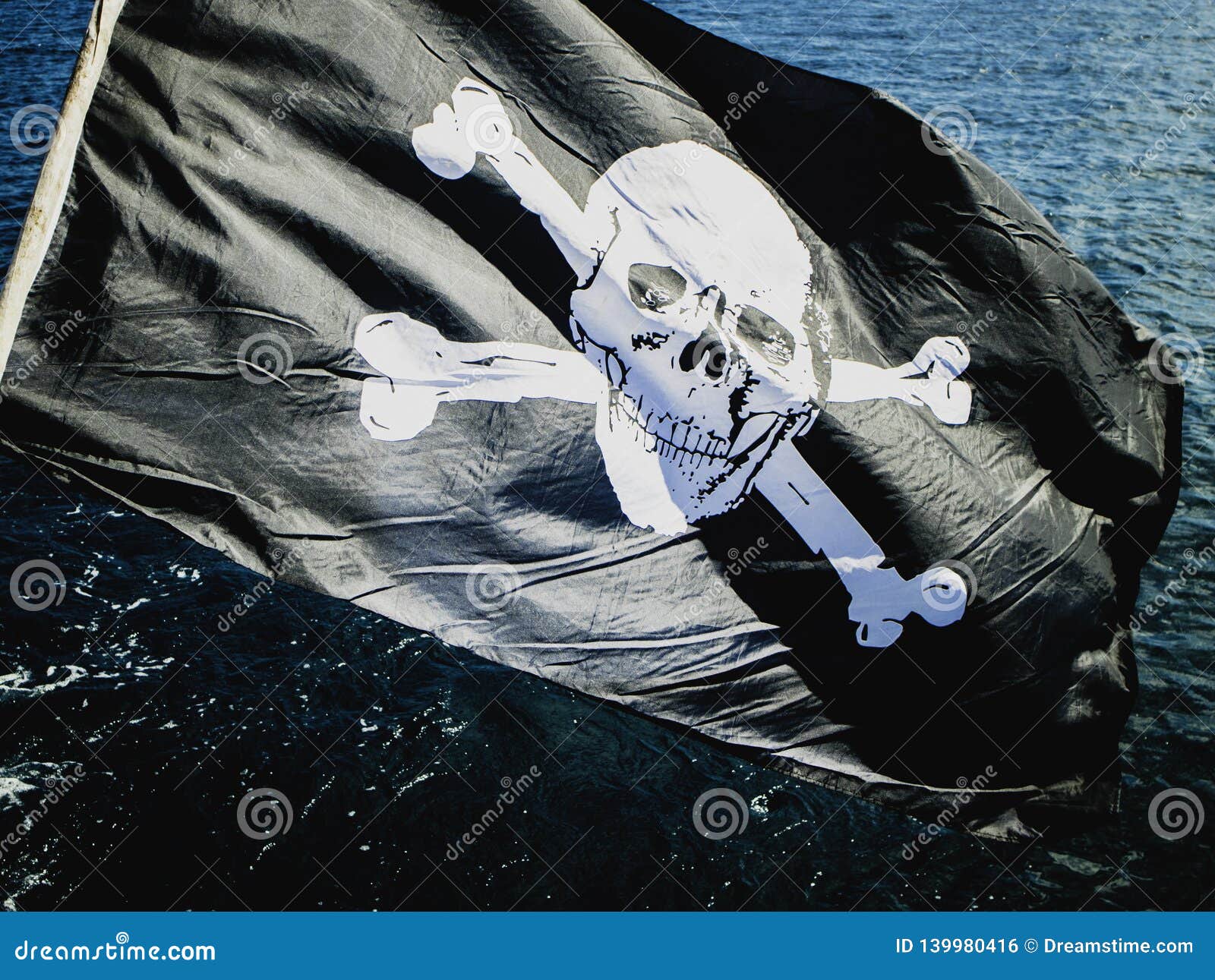 Jolly Rogers Pirate Flag Flying from a Sailing Boat Stock Photo - Image ...