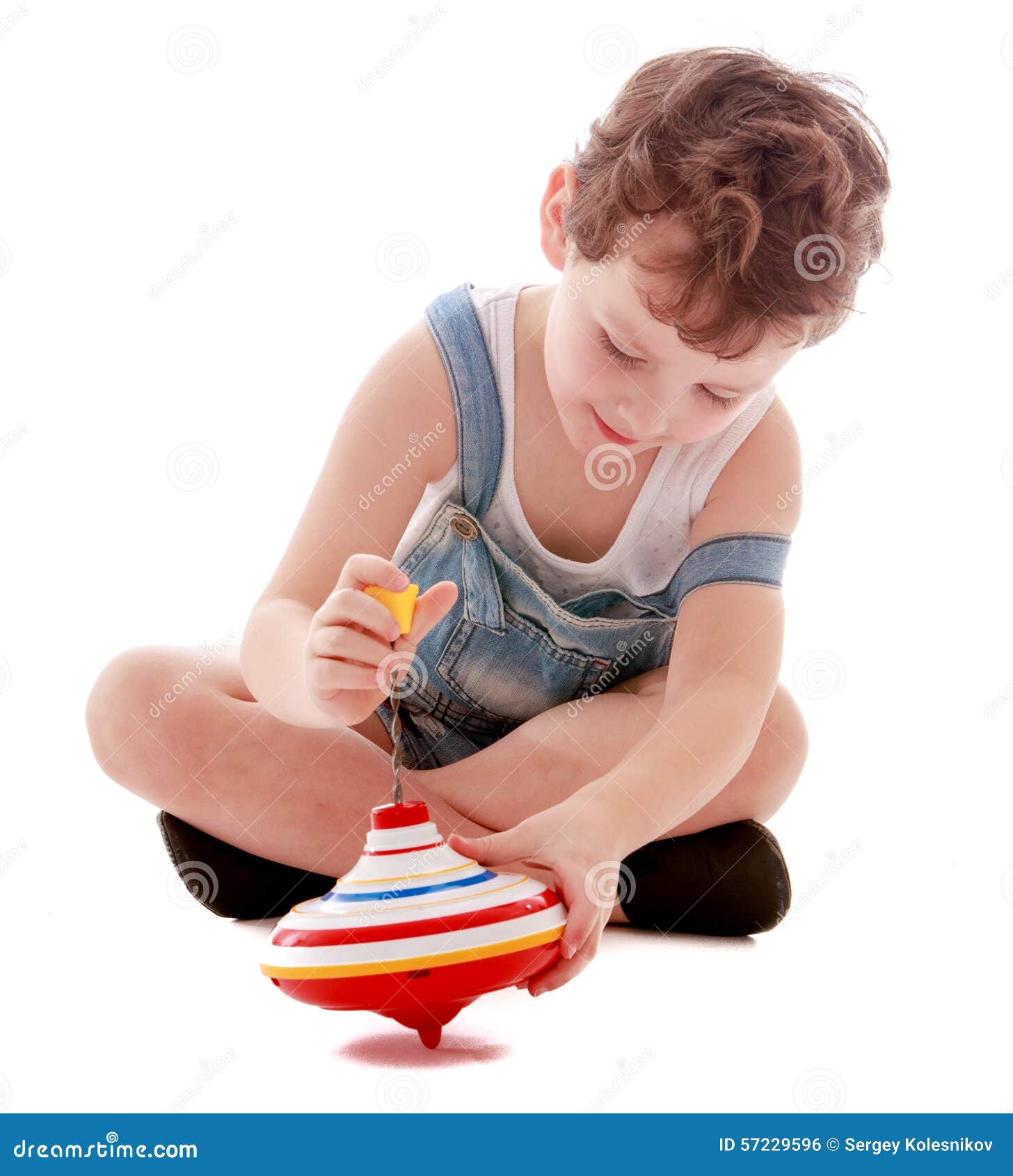 Jongen Het Spelen Met Een Tol Stock Foto - Image of huis, zitting: 57229596