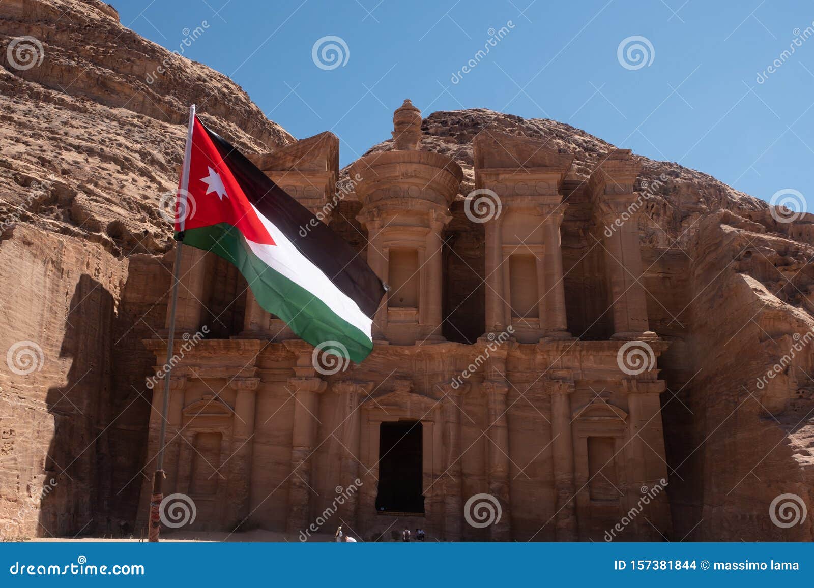 The Jordan flag in Petra stock photo. Image of building - 157381844