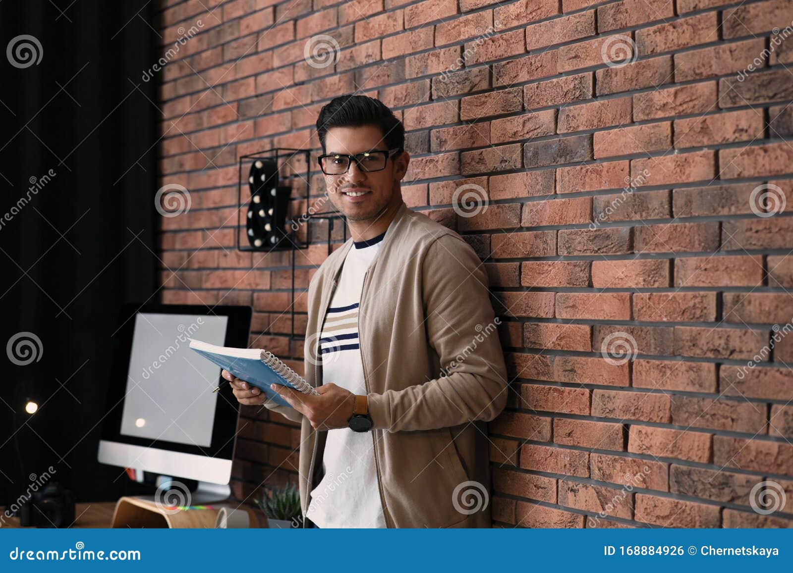 Journalist with Notebook Near Wall in Office Stock Photo - Image of ...