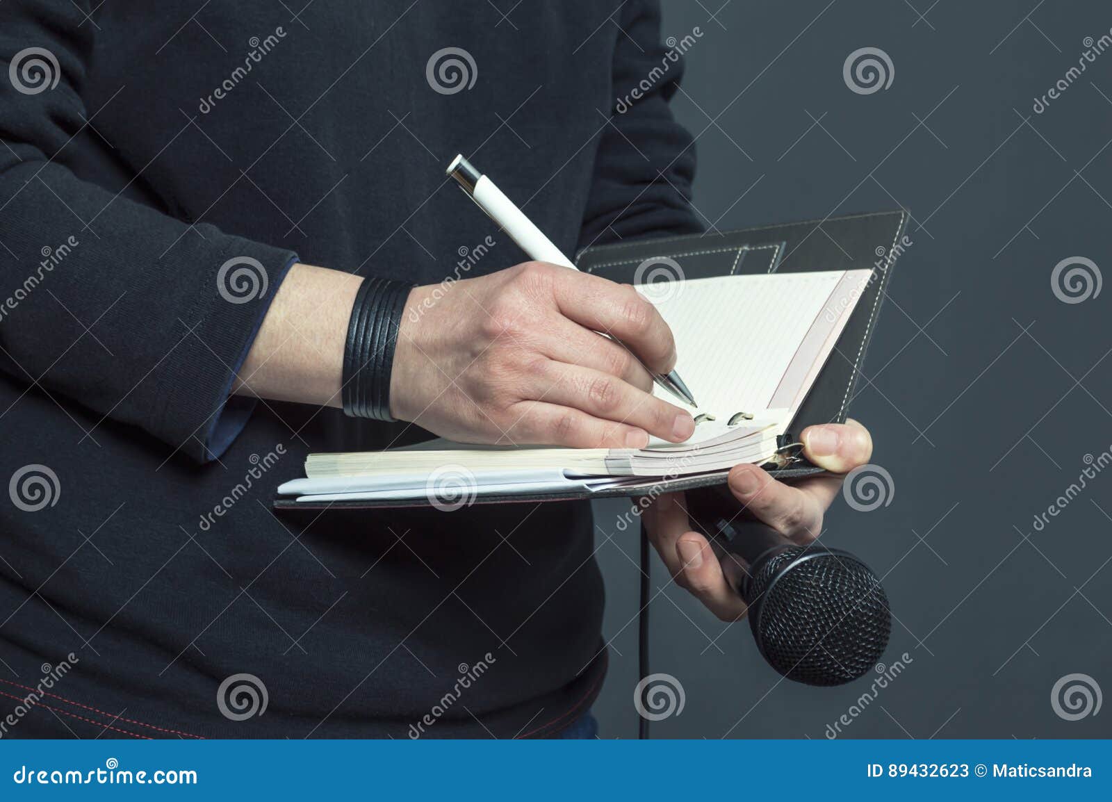 Journalist at Press Conference, Writing Notes, Holding Microphone ...