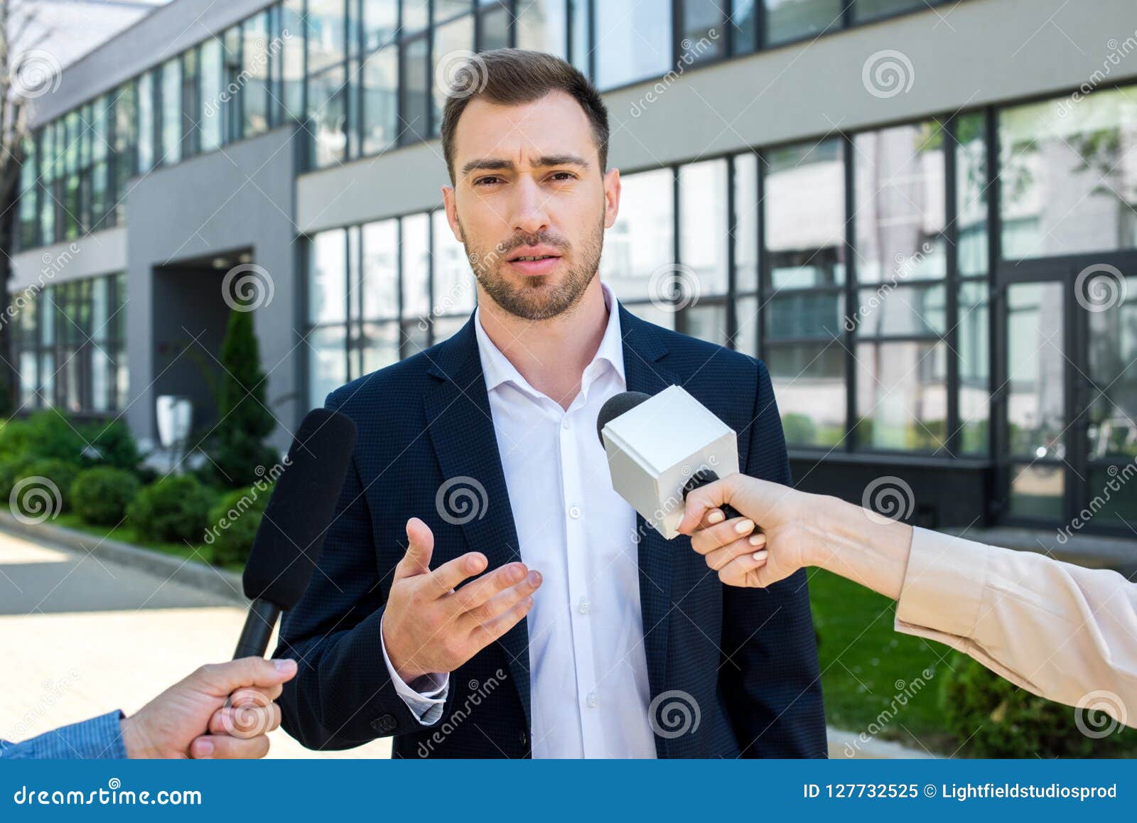 Journalists Interviewing Serious Businessman Stock Image - Image of ...