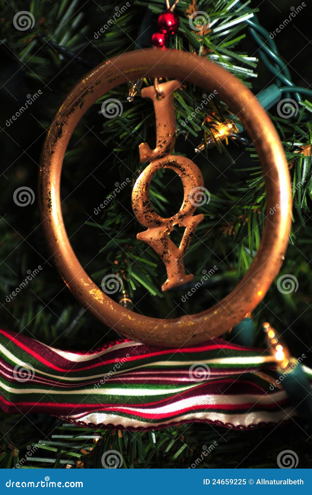 Joy Ornament on Christmas Tree Stock Image - Image of tree, ribbon ...