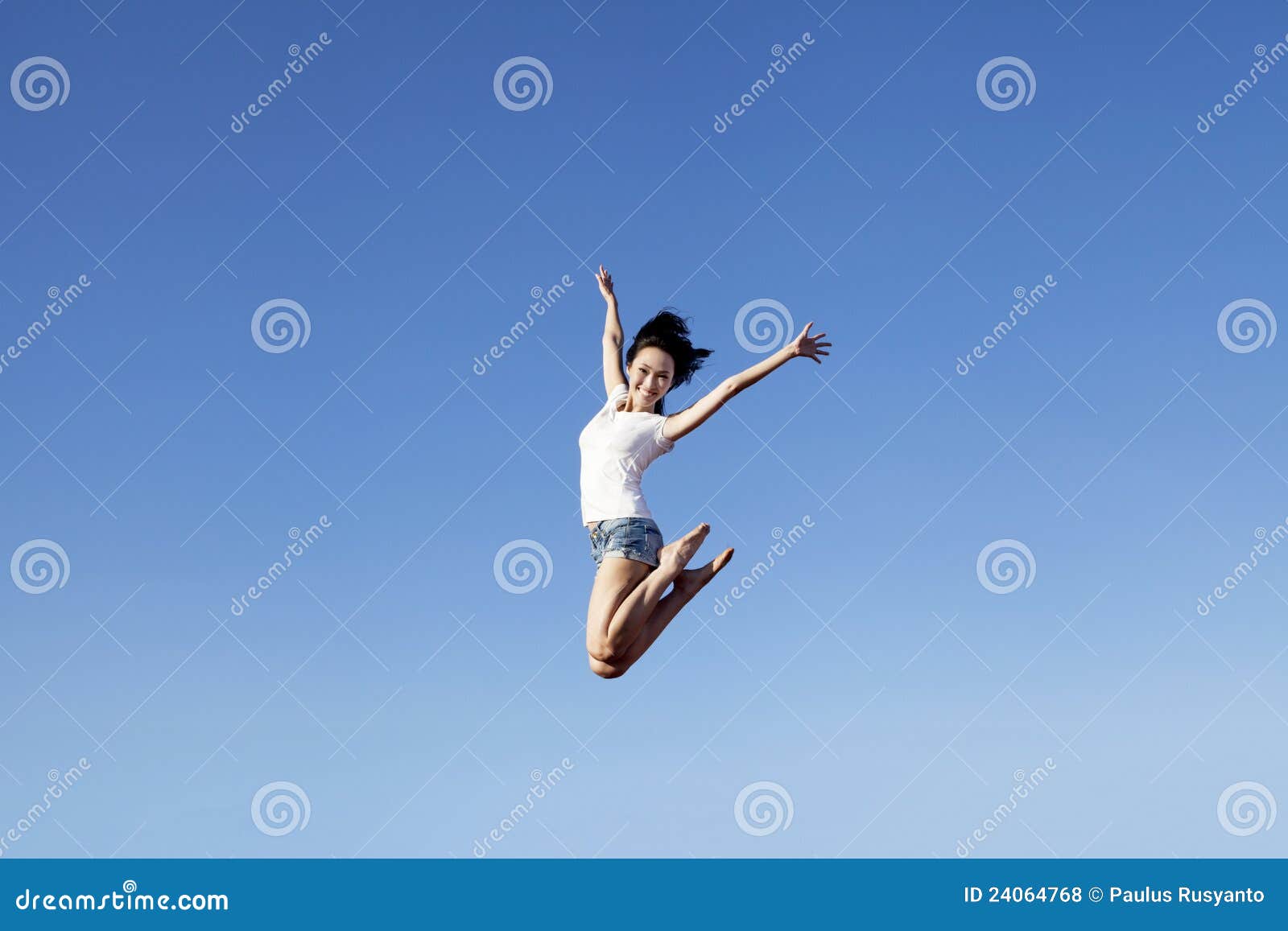 Joyful asian woman jumping stock photo. Image of enjoy - 24064768