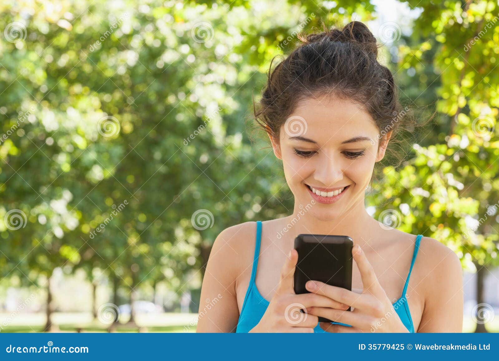 Joyful Attractive Woman Dialling with Her Smartphone Stock Image ...