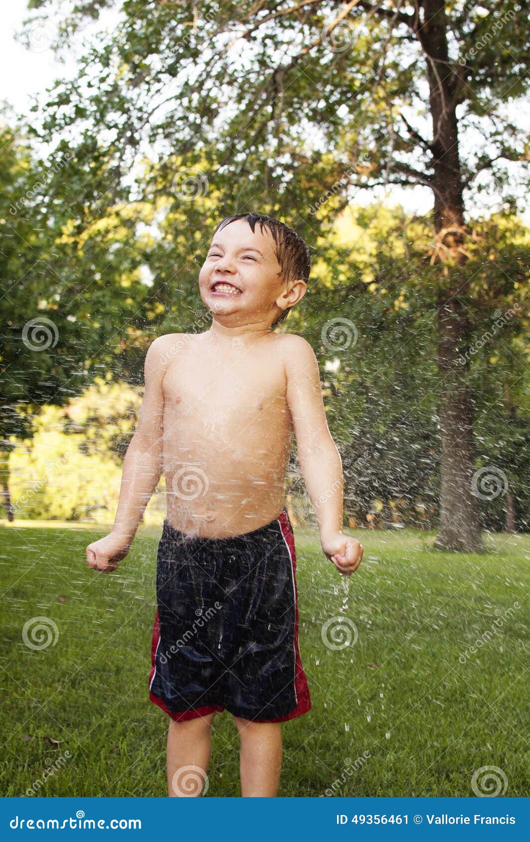 Joyful Boy Getting Sprayed with Cold Water Stock Image - Image of ...