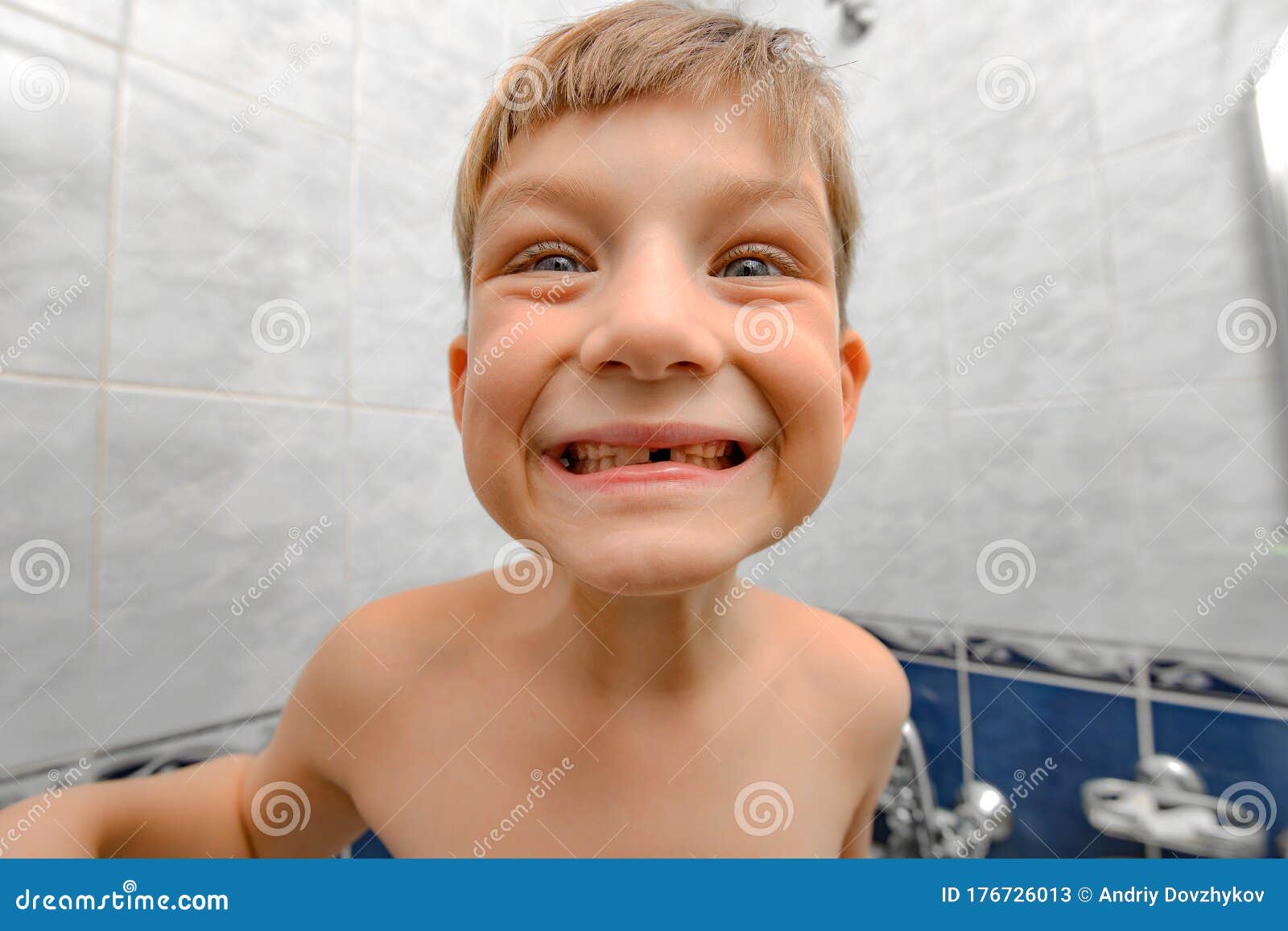 Joyful Boy in the Shower Room Shows His Teeth after Brushing Stock ...
