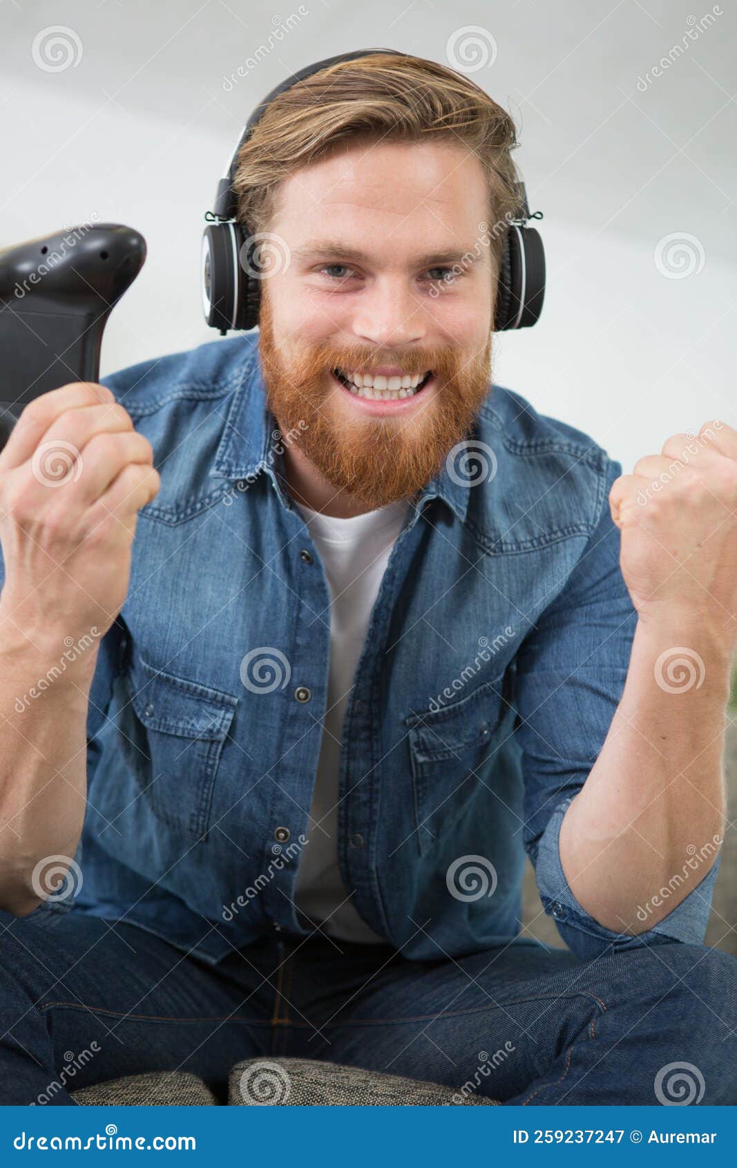 Joyful Bristled Young Man Holding Video Game Controller Stock Image ...