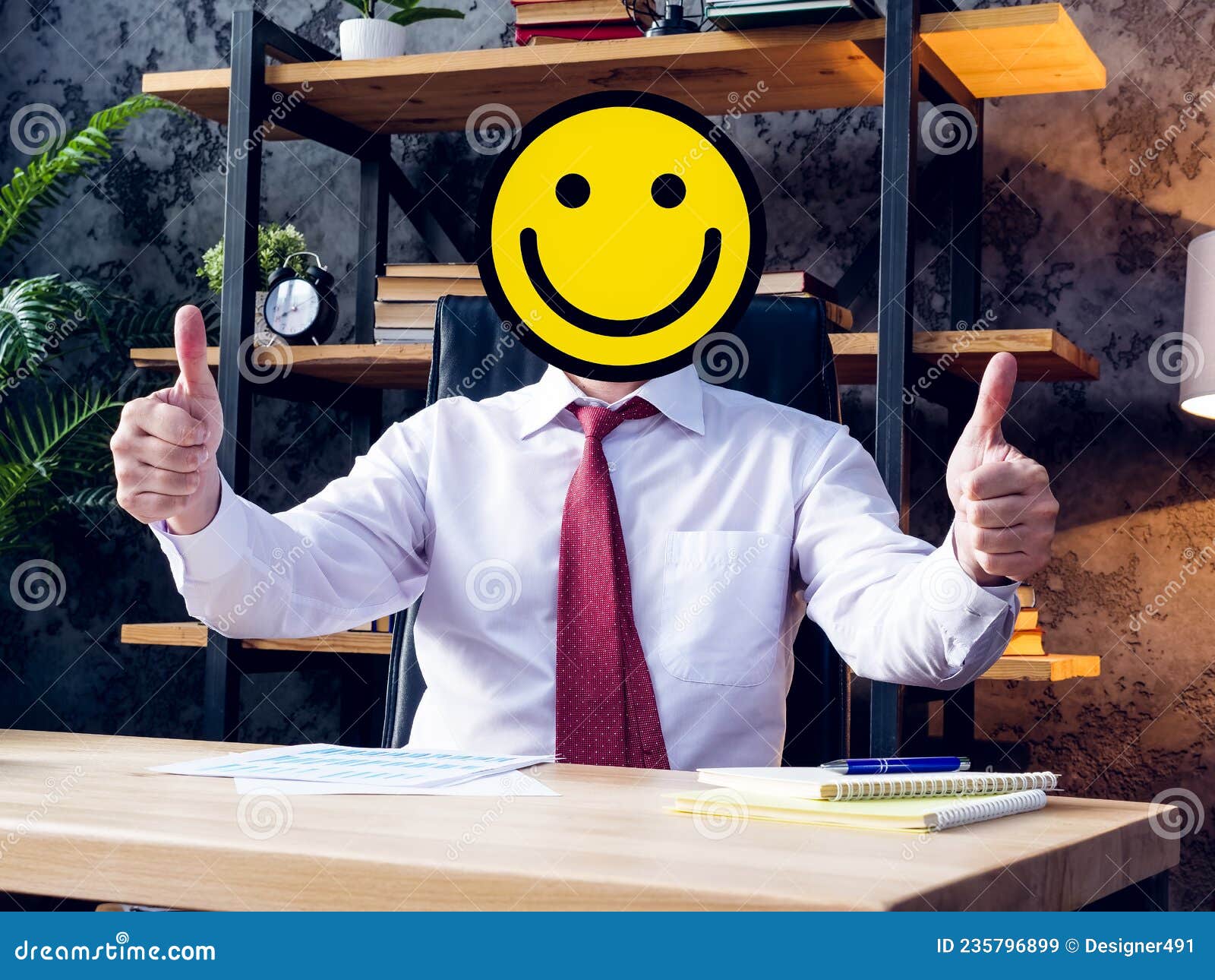 Joyful Businessman at the Table with a Smiley Face instead of a Head ...