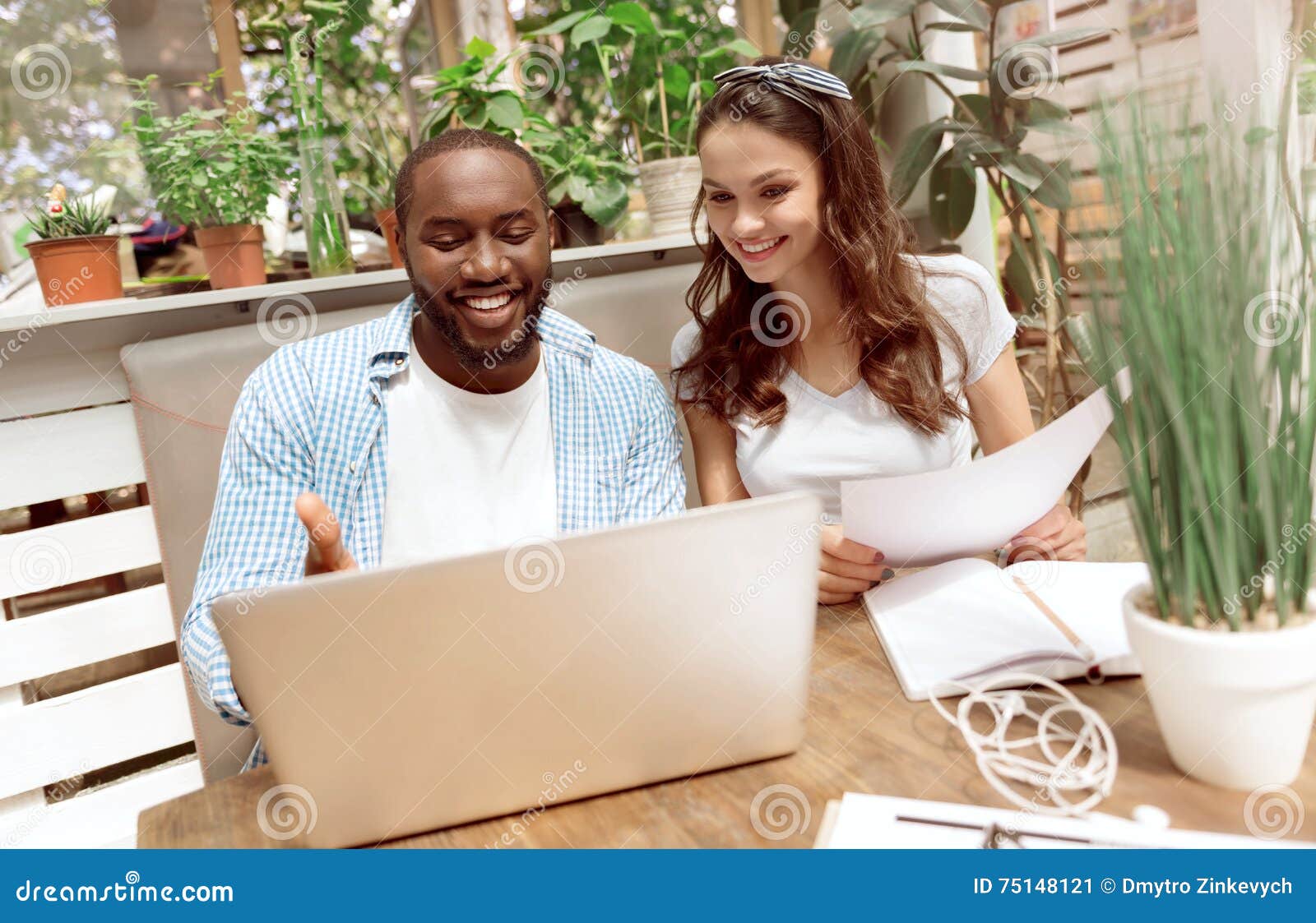 Joyful Colleagues Sitting at the Table Stock Image - Image of device ...