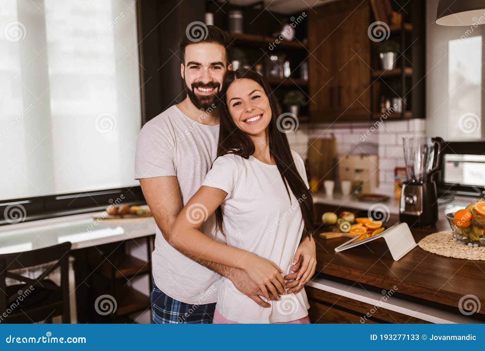Couple Hugging in the Kitchen at Home in the Morning Stock Image ...