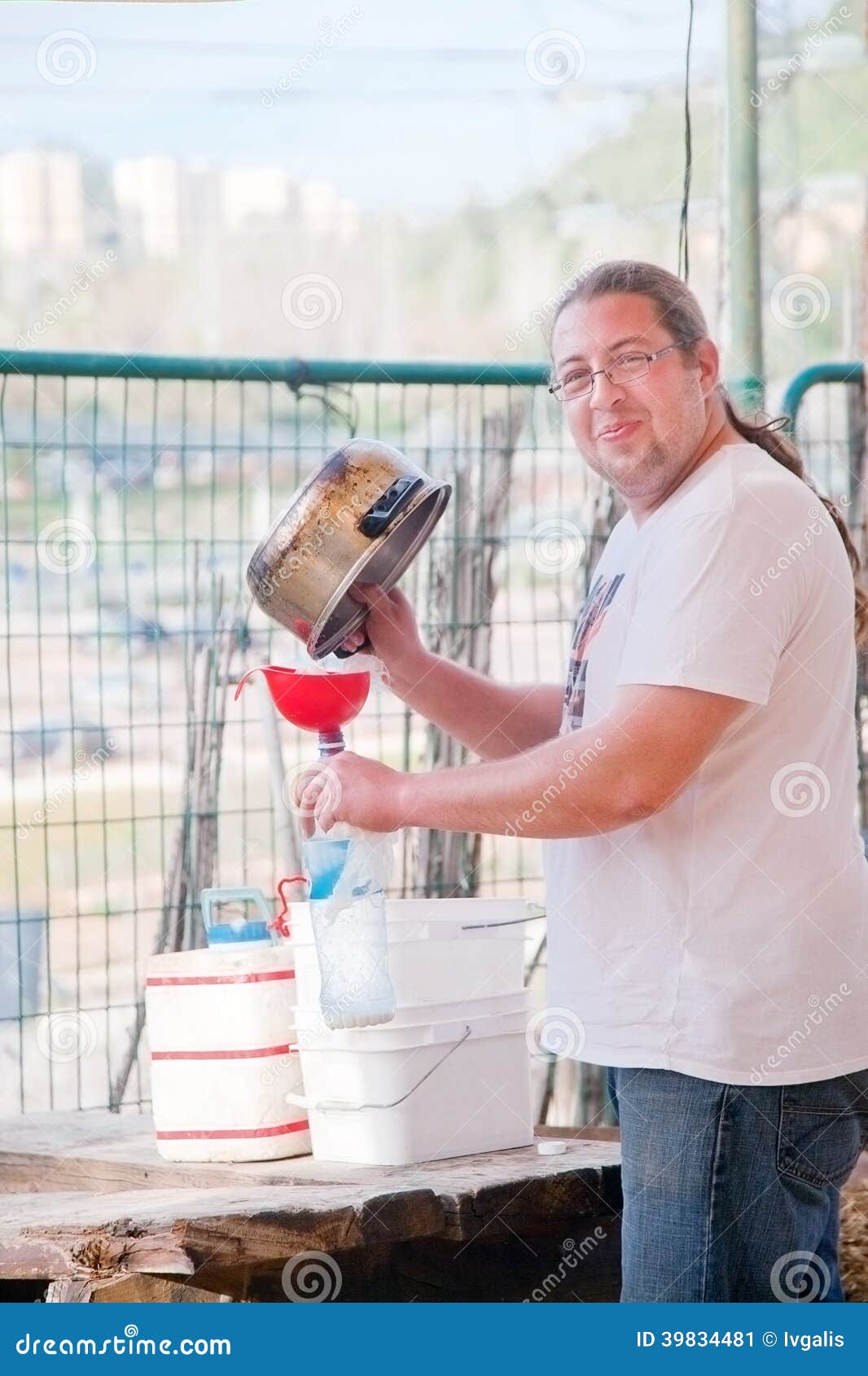 Joyful Farmer Filtering Milk Stock Image - Image of domestic, filtering ...