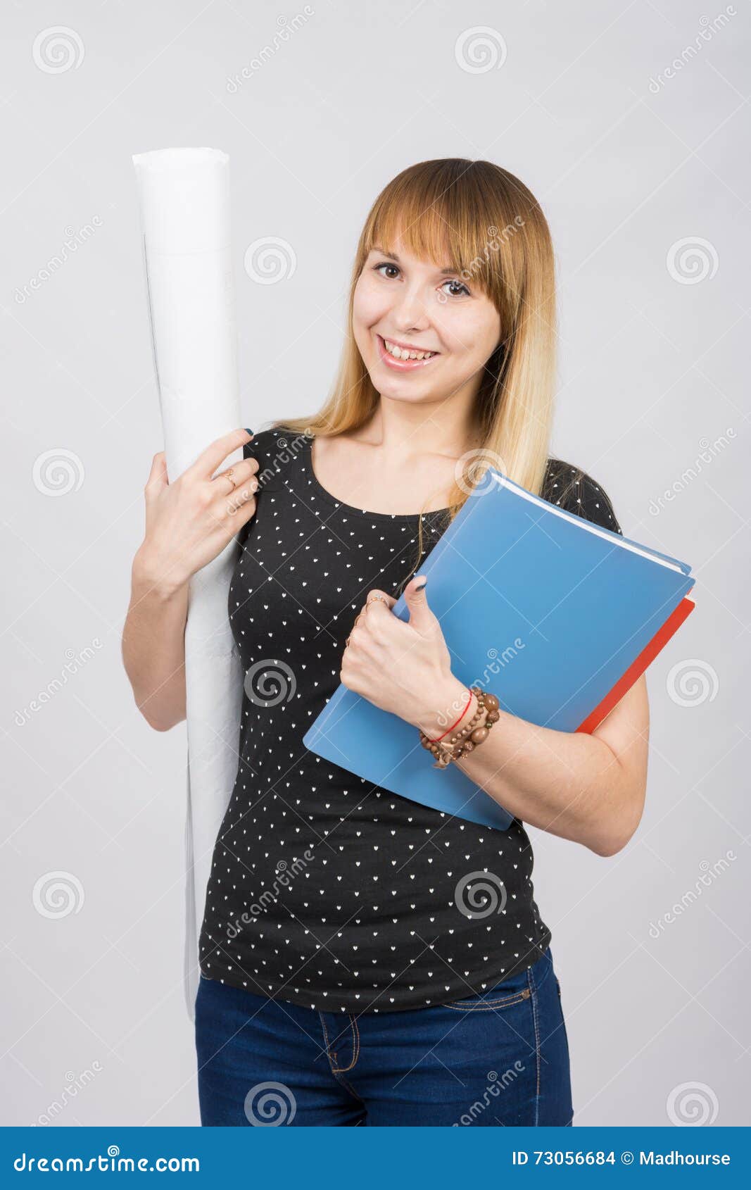 Joyful Girl with a Roll of Drawings and a Folder in Hands Stock Photo ...