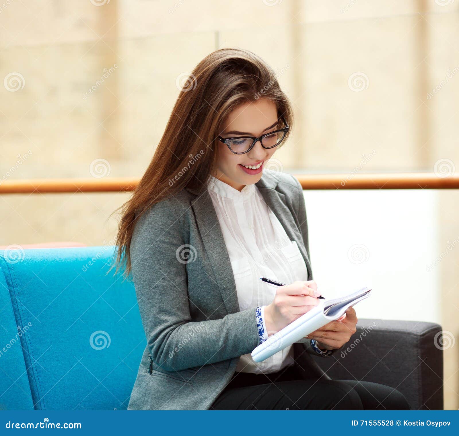Joyful Girl Student Writing in Notebook Indoors Stock Photo - Image of ...