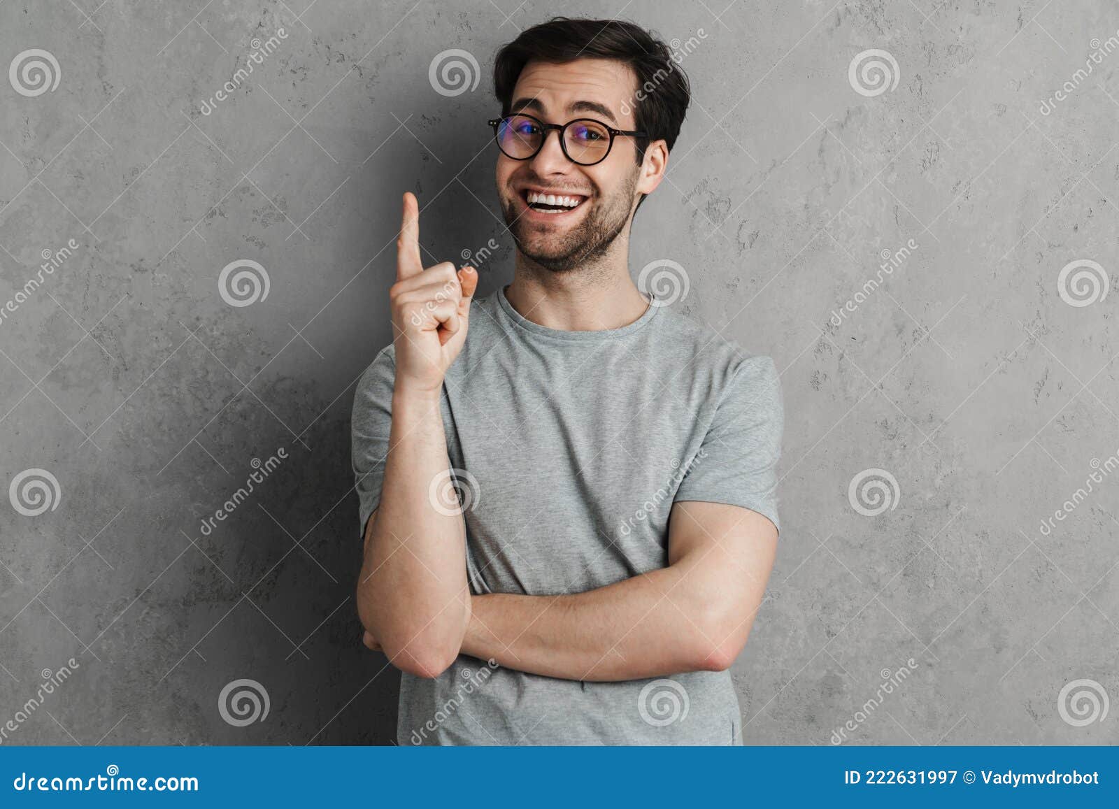 Joyful Handsome Guy Smiling and Pointing Finger Upward Stock Image ...