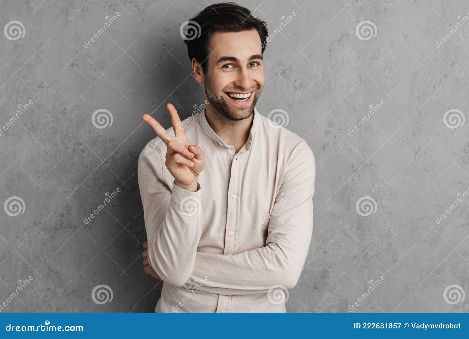 Joyful Handsome Guy Smiling and Showing Peace Sign Stock Image - Image ...
