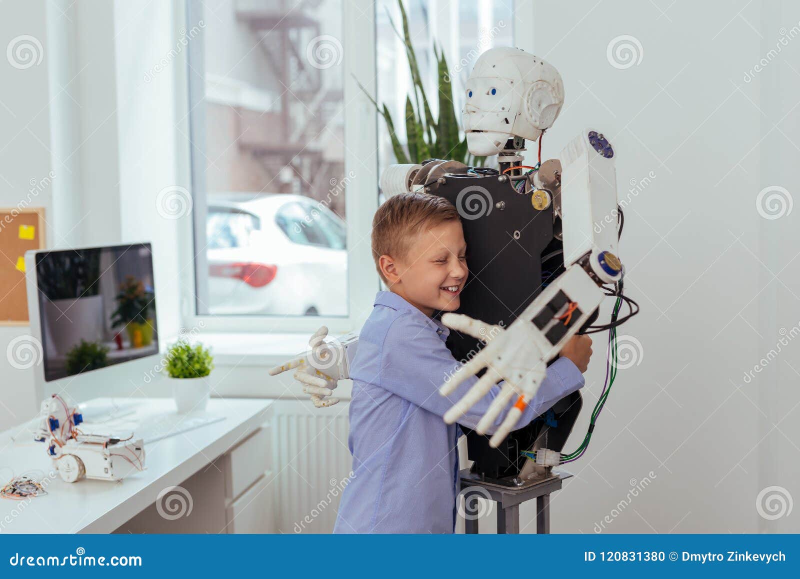 Joyful Happy Boy Hugging a Robot Stock Photo - Image of connected ...