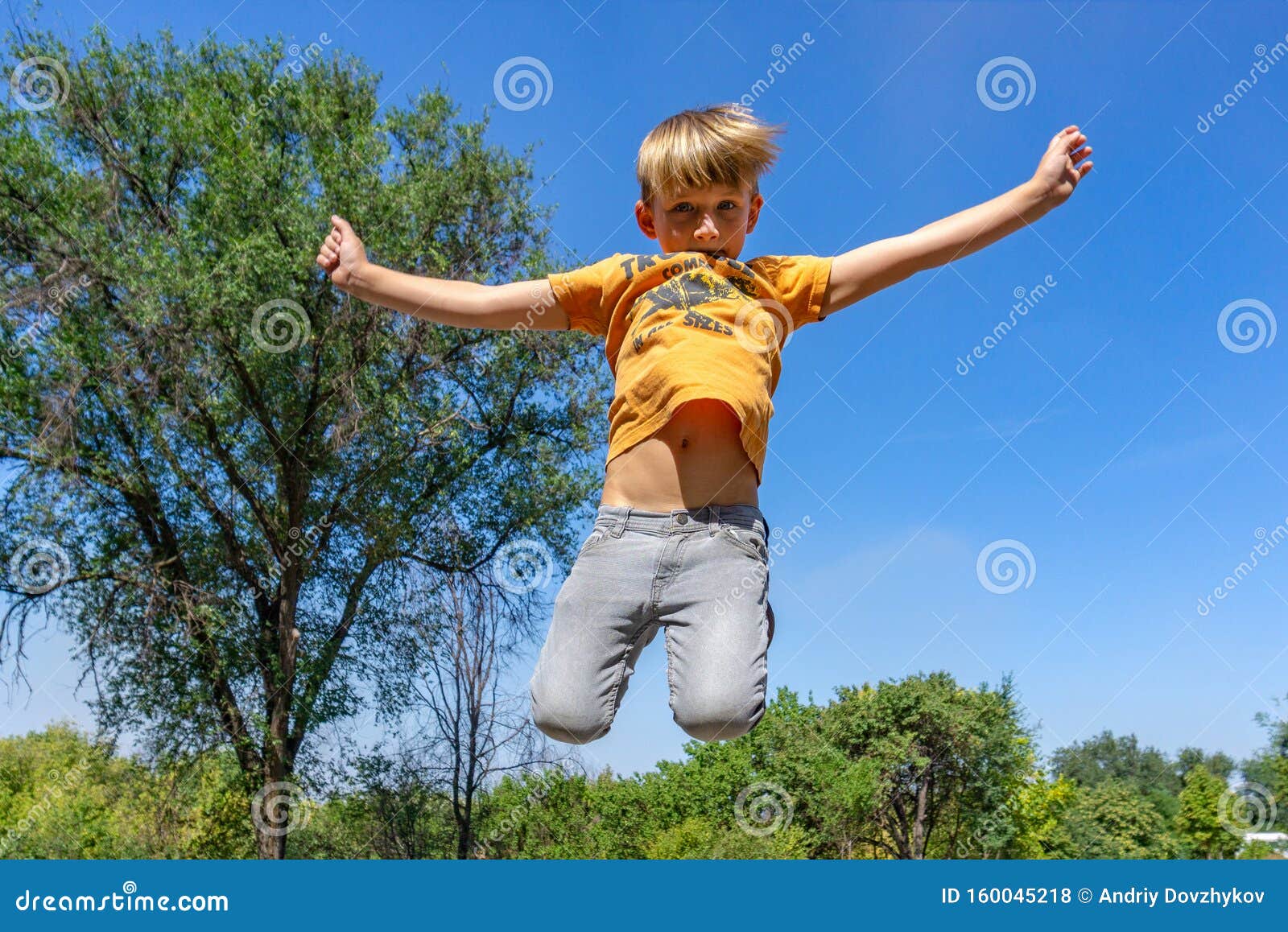 Joyful and Happy Boy is Jumping Up on the Road Stock Photo - Image of ...