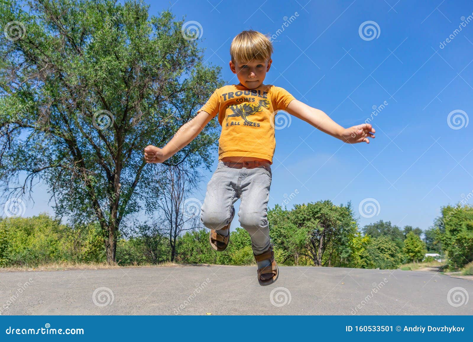 Joyful and Happy Boy is Jumping Up on the Road Stock Image - Image of ...