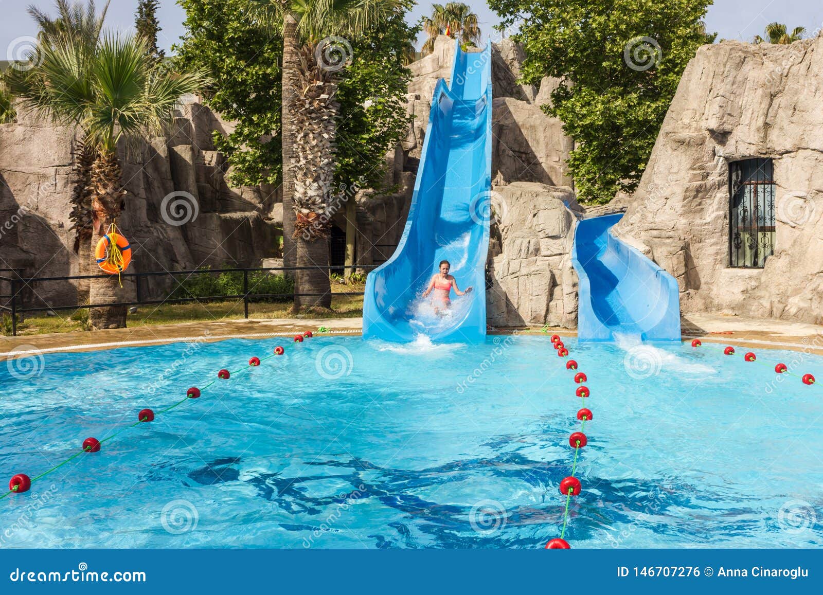 Joyful Laughing Teen Girl Goes Down By Water Slide In The Hotel