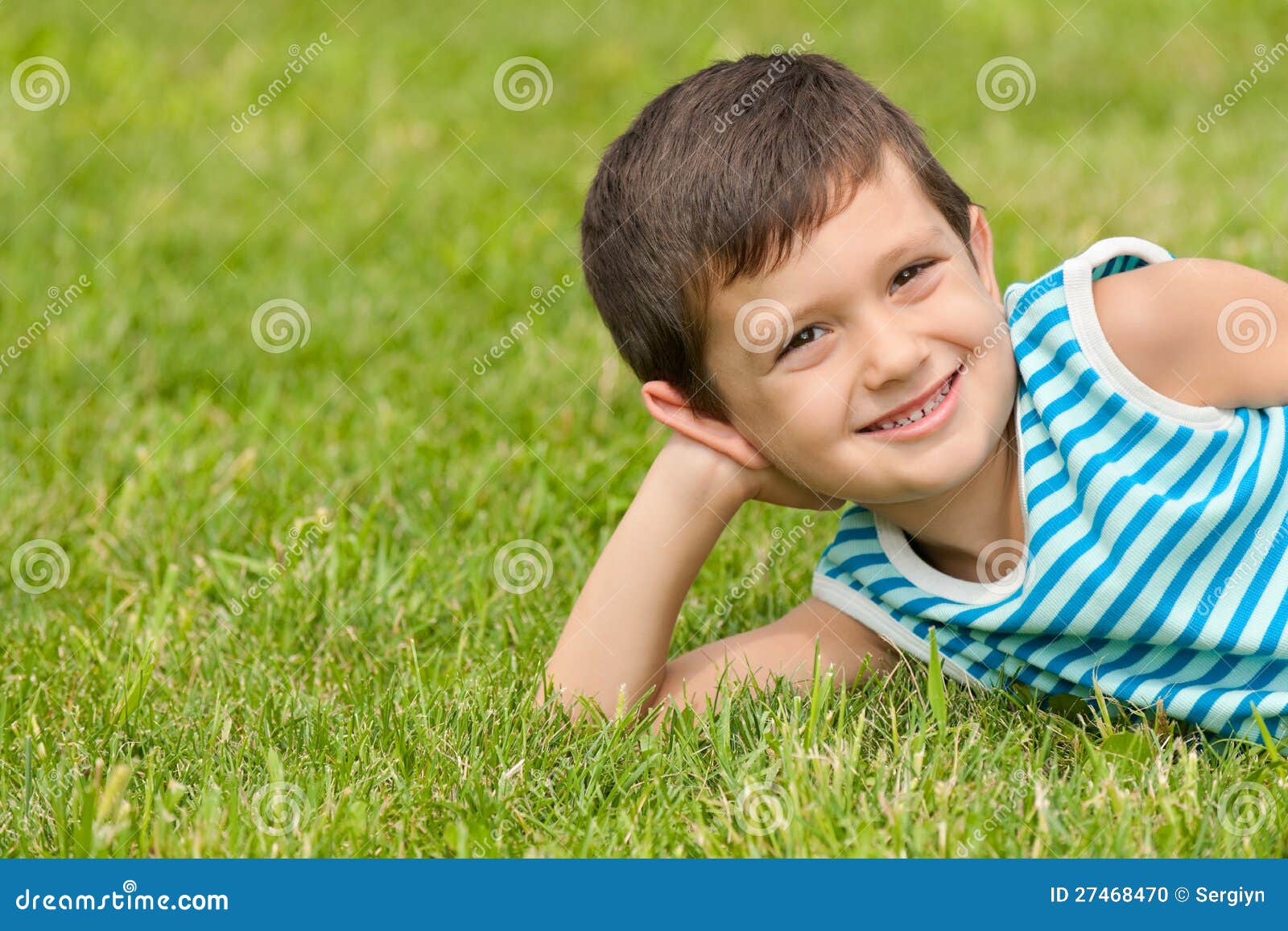Joyful Little Boy on the Grass Stock Photo - Image of looking, person ...