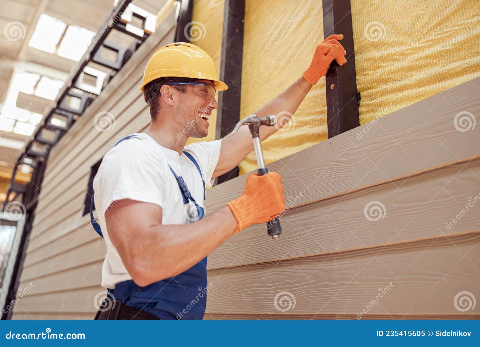 Joyful Male Builder Using Hammer at Construction Site Stock Image ...