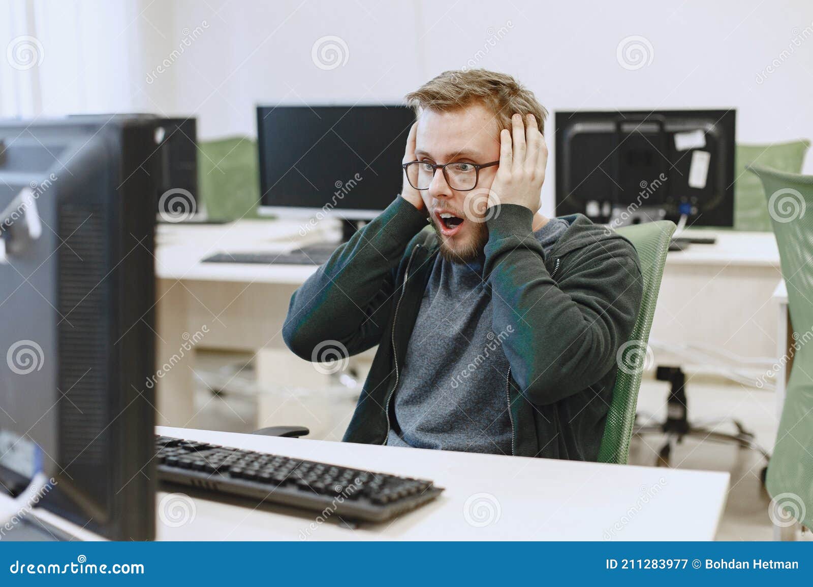 Joyful Man Sitting at the Computer. Stock Image - Image of indoor ...