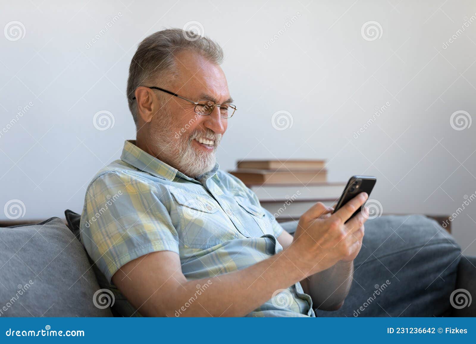 Joyful Middle Aged Old Man Using Cellphone. Stock Photo - Image of rest ...