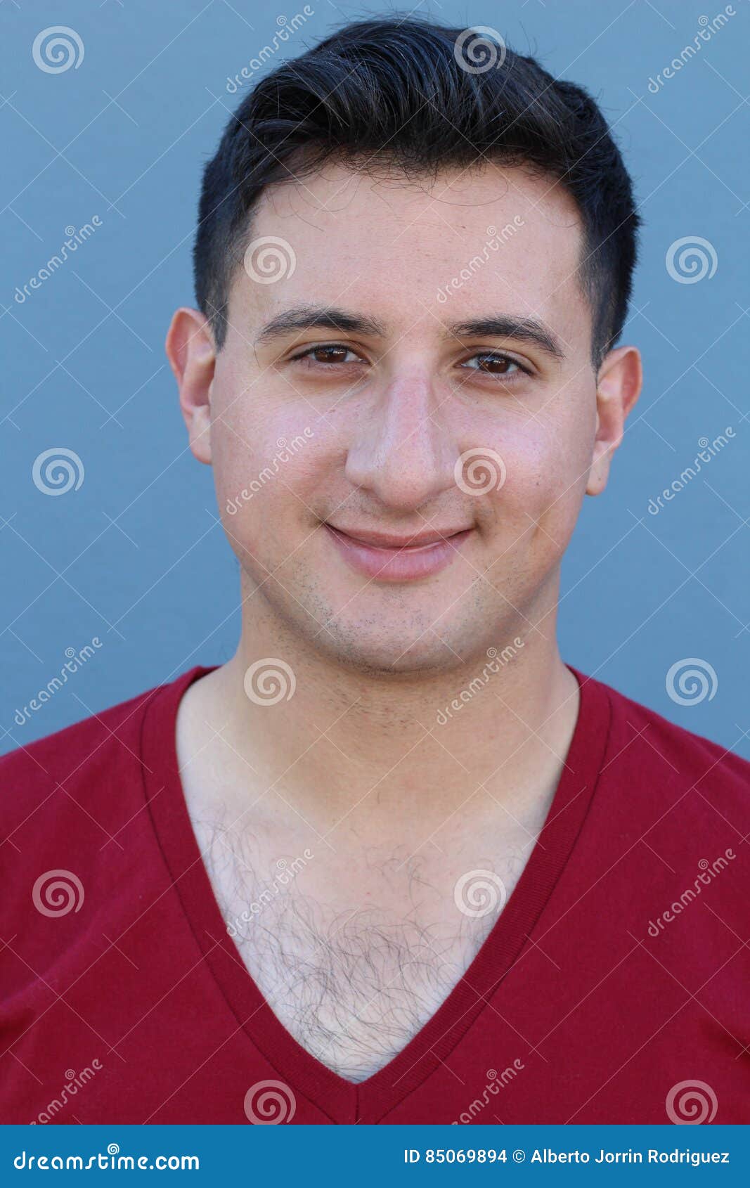 Joyful Natural Guy Against Blue Background - Stock Image Stock Photo ...