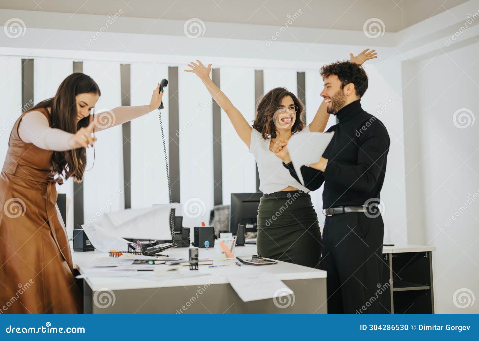 Energetic Business Team Celebrating Success in Modern Office ...