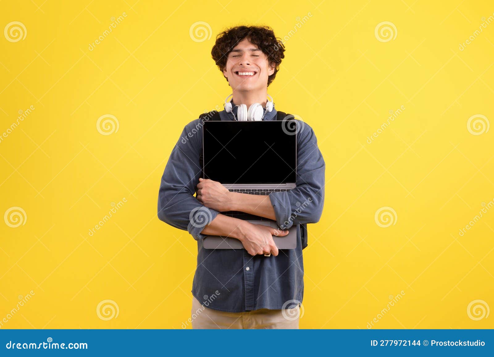 Joyful Student Guy Hugging Laptop Computer Posing Over Yellow ...