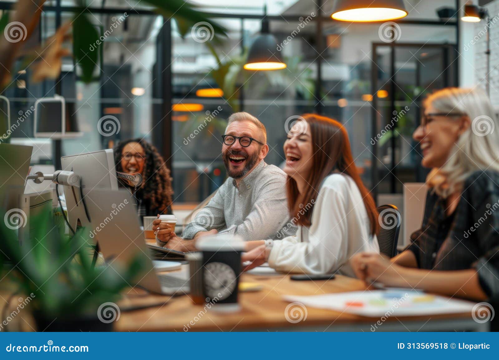 Joyful Team Laughing Together in a Vibrant Office Setting Stock ...