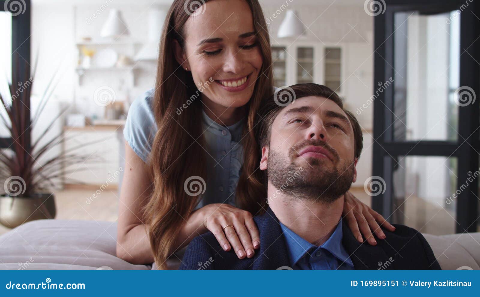 Joyful Woman Making Surprise To Man At Home Wife Massaging Husband