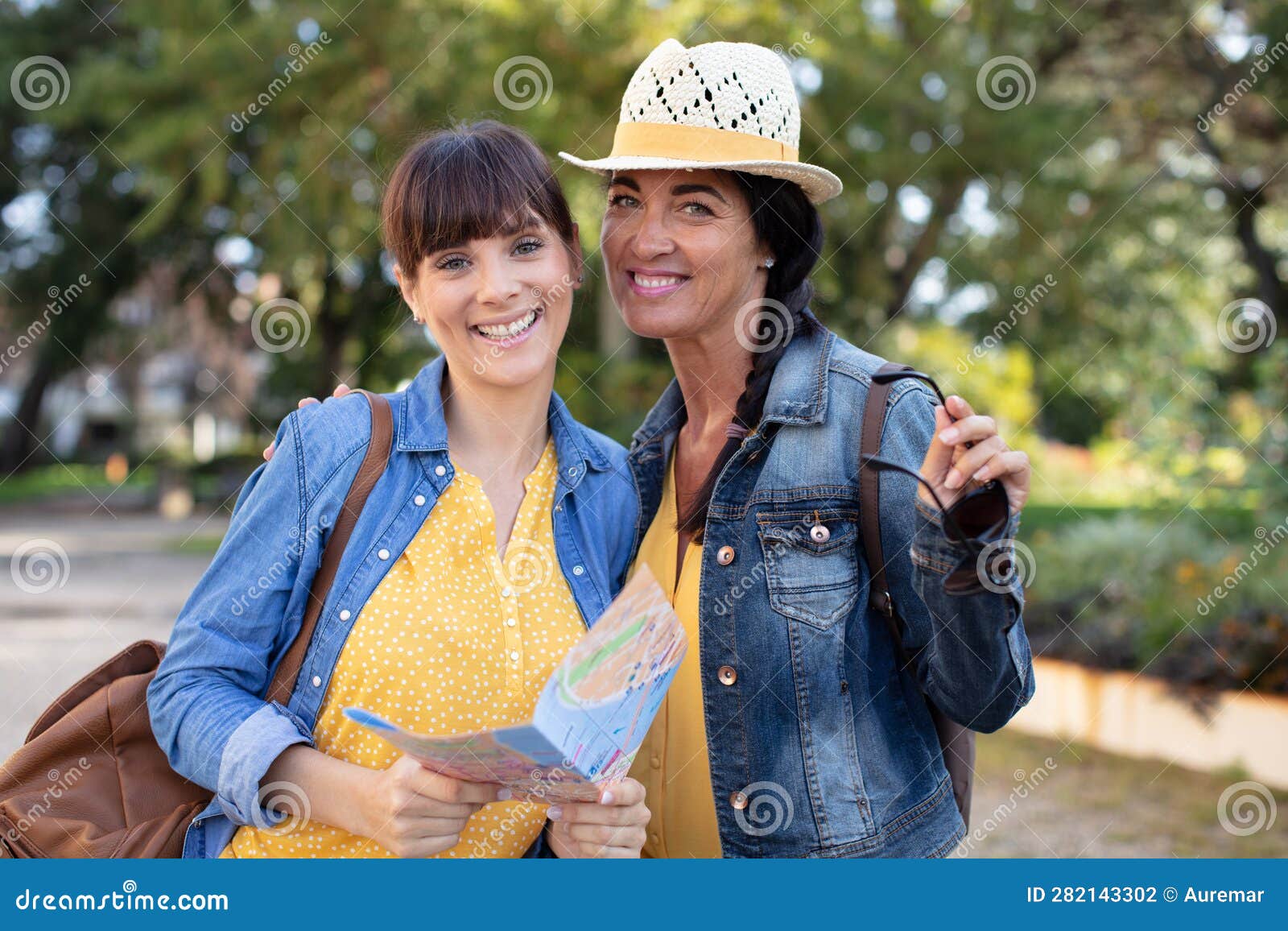 Joyful Women Expressing Positivity Using Map on Vacation Stock Photo ...
