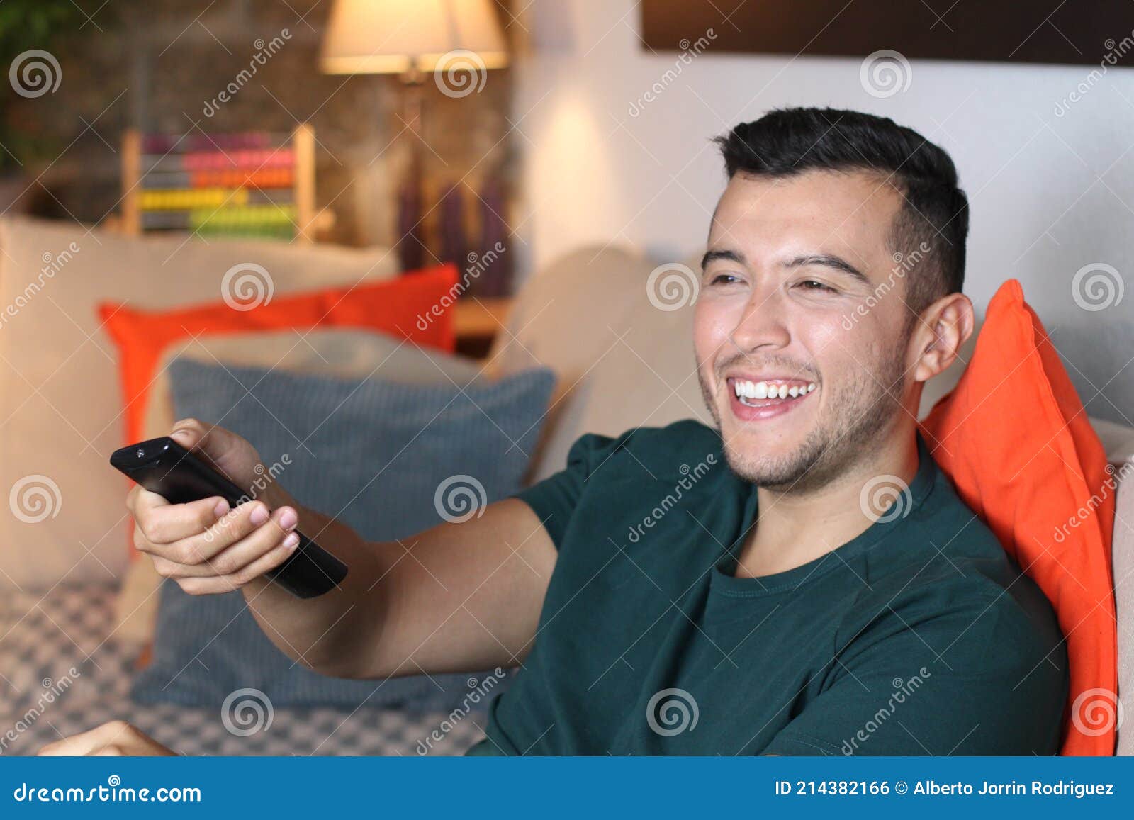 Joyful Young Guy Watching Television Stock Photo - Image of couch, cozy ...