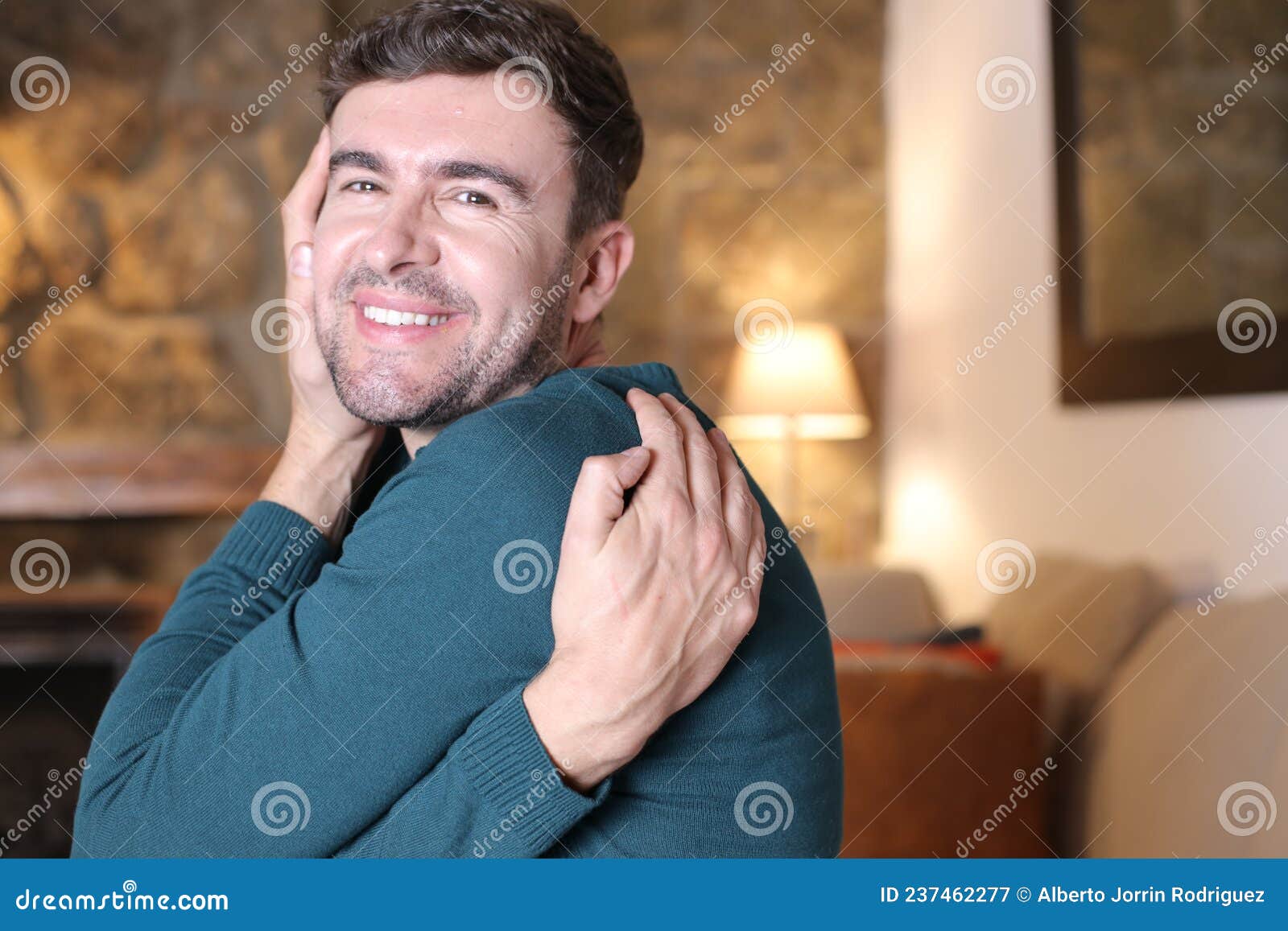 Joyful Young Man Hugging Himself Stock Image - Image of expression ...