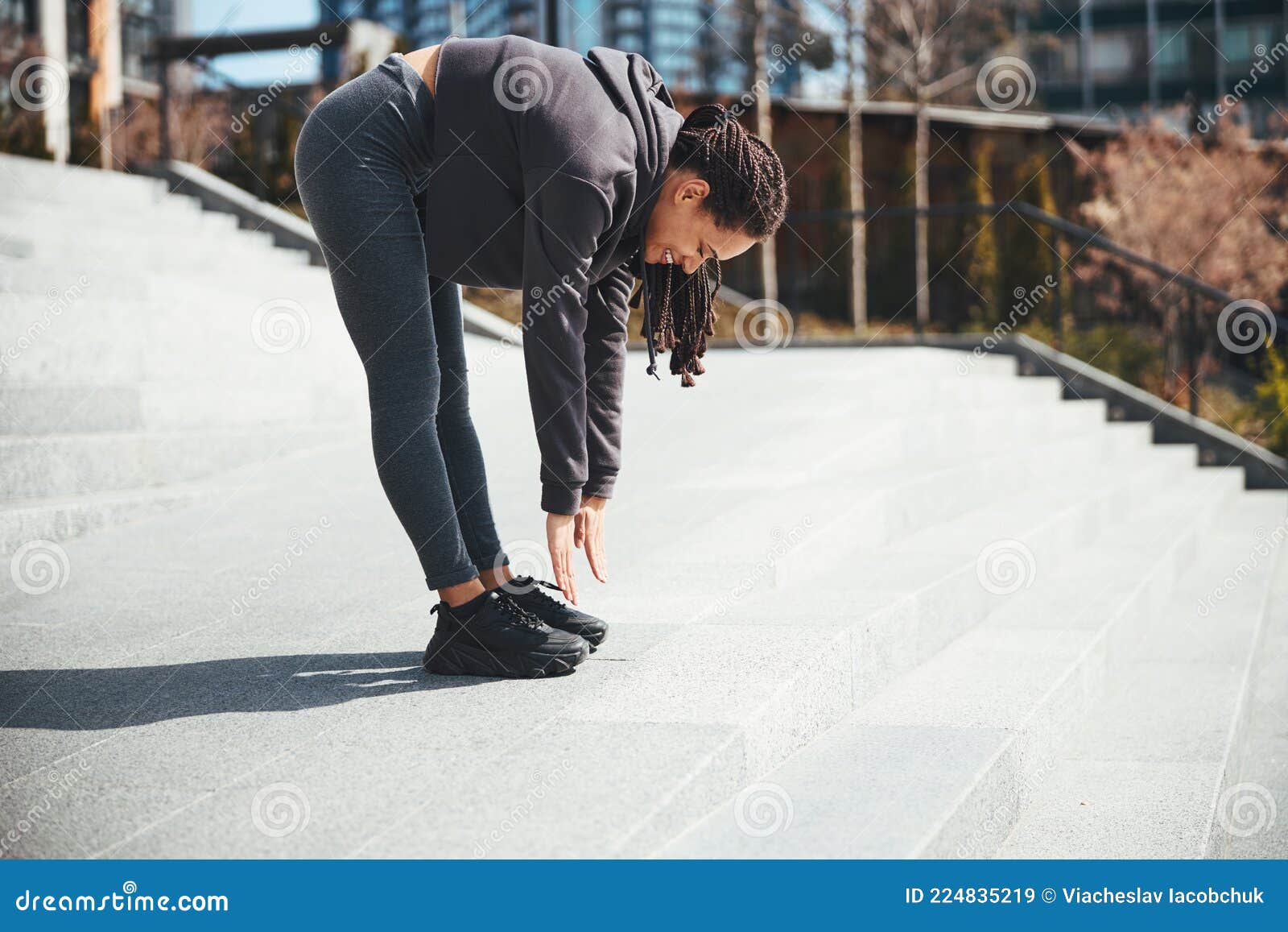 Joyous Athlete Performing a Forward Bend Outside Stock Image - Image of ...