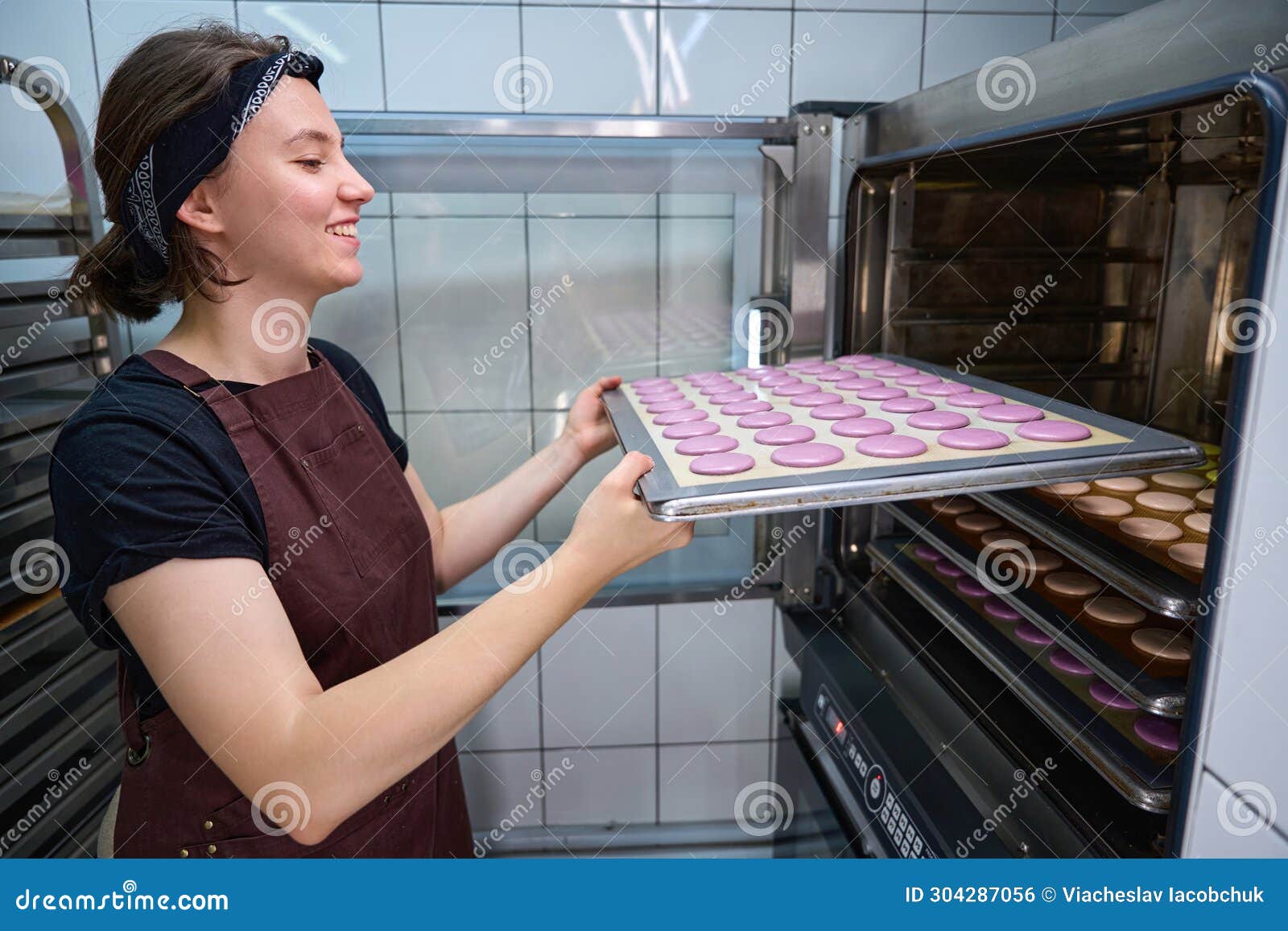 Joyous Young Baker is Baking Cookies in Bakery Kitchen Stock Photo ...