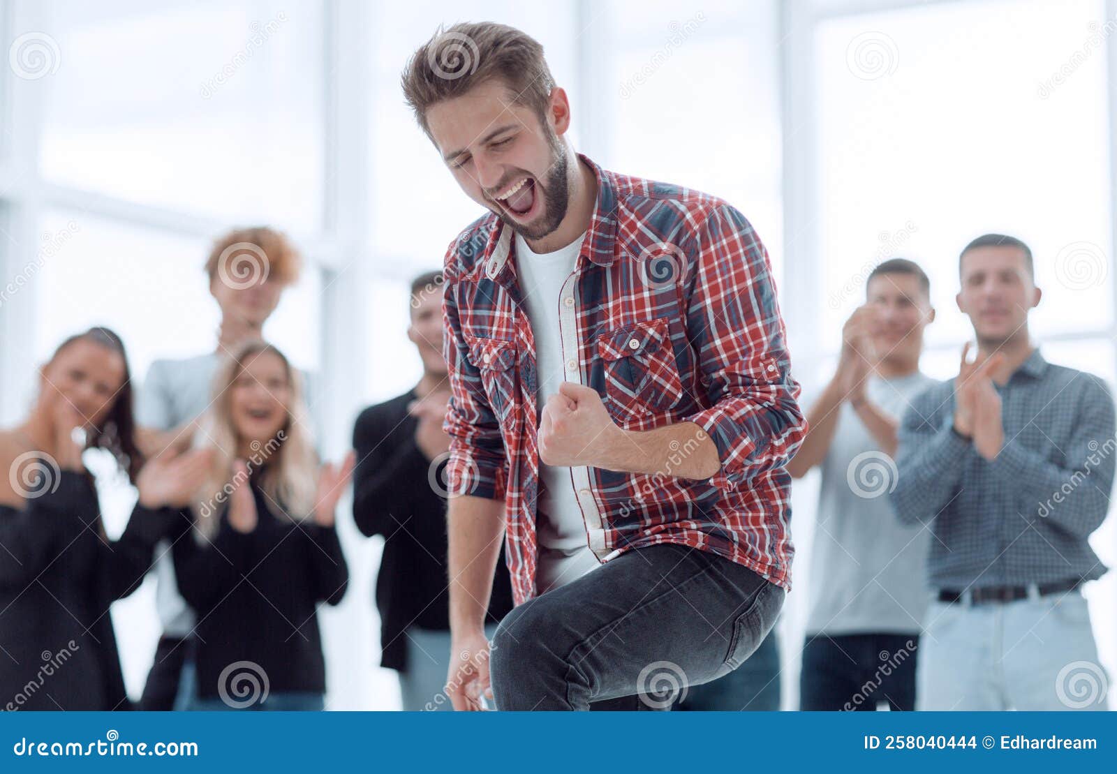 Jubilant Leader Standing in Front of the Business Team. Stock Photo ...