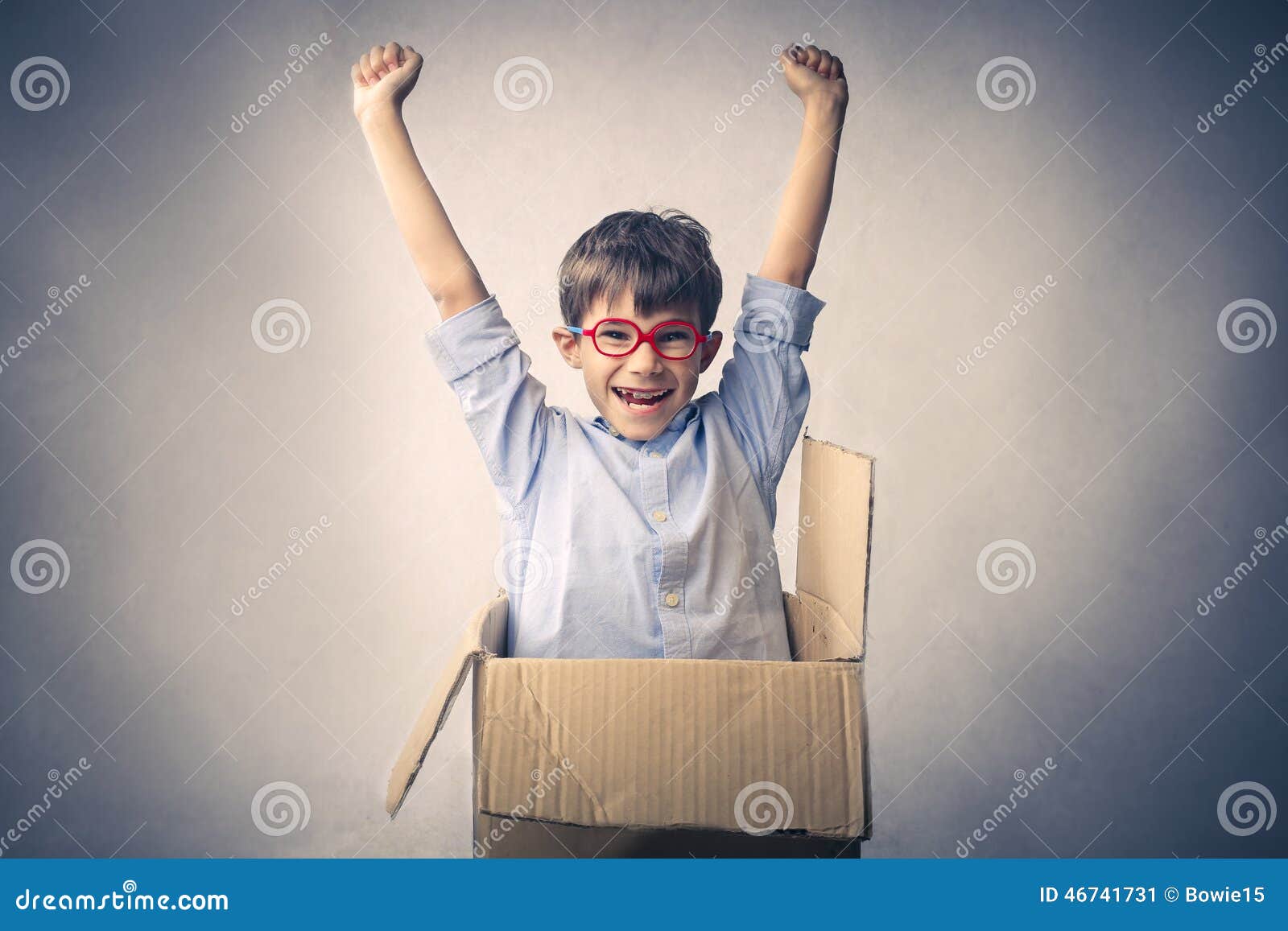 Jubilating litte kid stock image. Image of smile, cardboard - 46741731