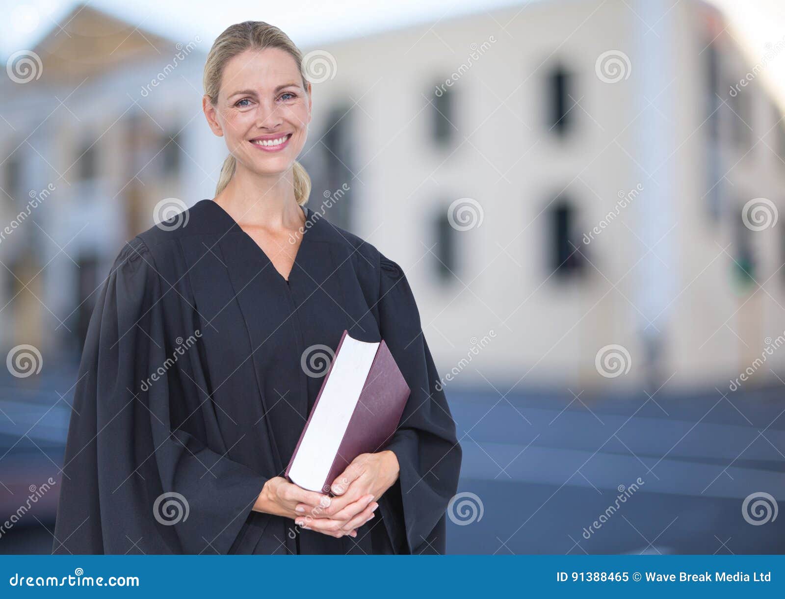 Judge Holding Book in Front of Building Stock Image - Image of ...