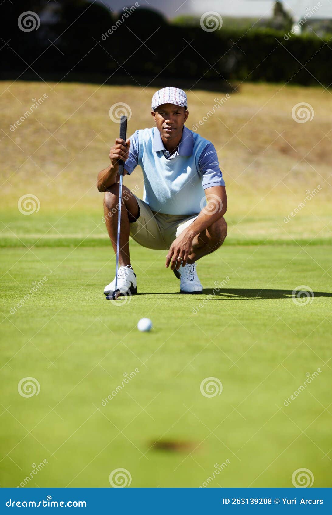 Judging a Long Putt. a Golfer Crouching on the Green and Eyeing Up a ...