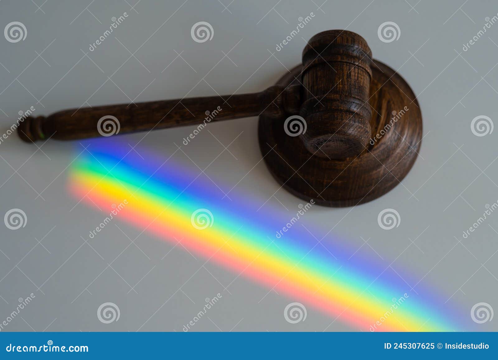 Judicial Gavel on a Table with a Rainbow Light Prism. Stock Image ...